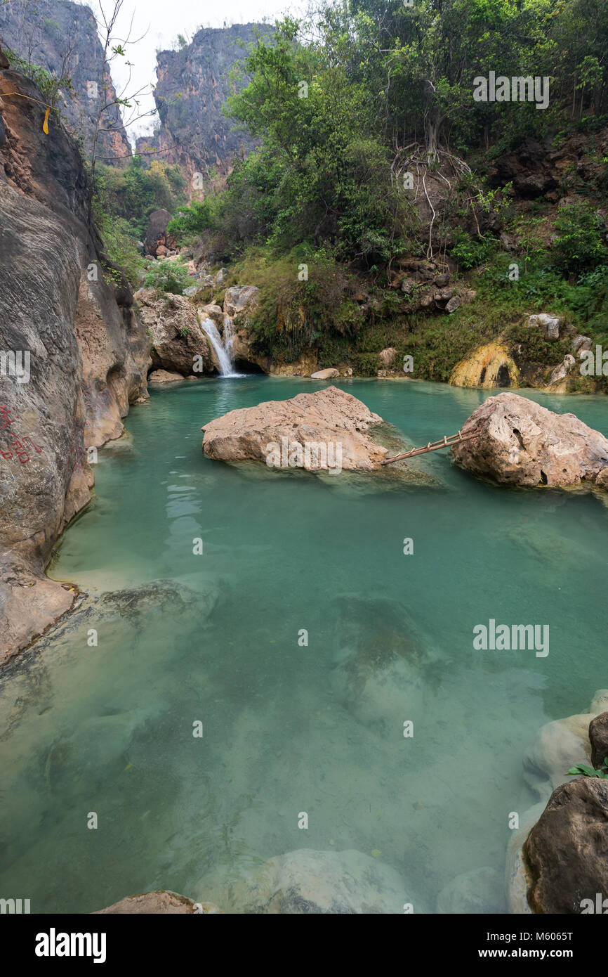 Rocks, pond and a small waterfall at the Deed Doat Waterfalls near ...