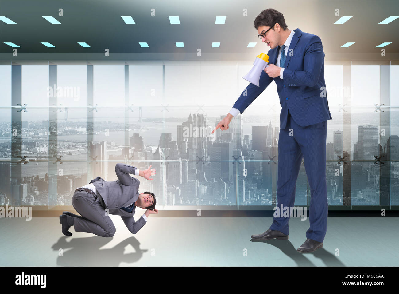 Bad angry boss shouting at employee with loudspeaker Stock Photo - Alamy