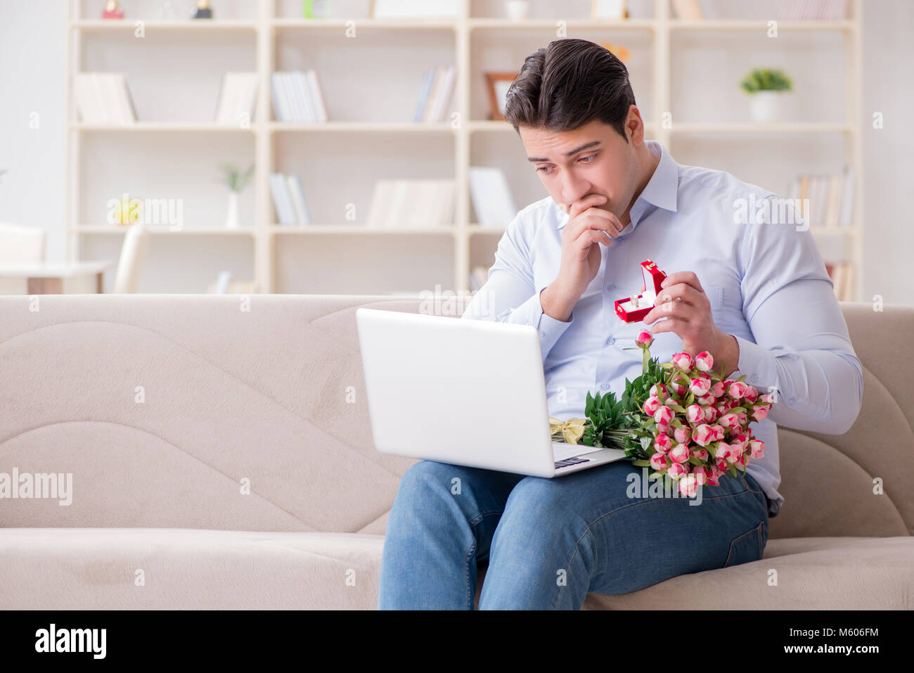 Young man making marriage proposal over internet laptop Stock Photo - Alamy