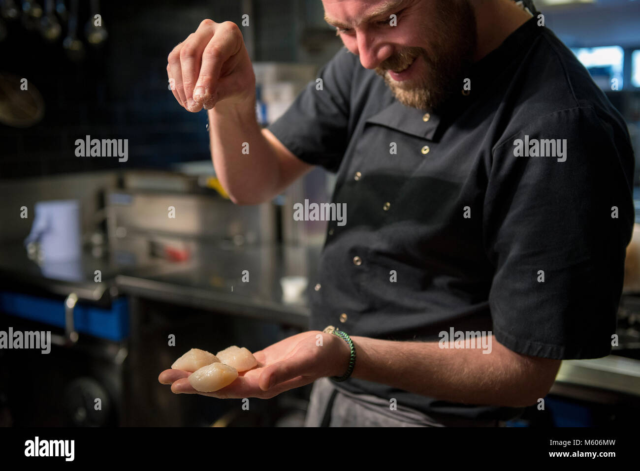 the head chef at a specialist restaurant cooks some amazing food in the ...