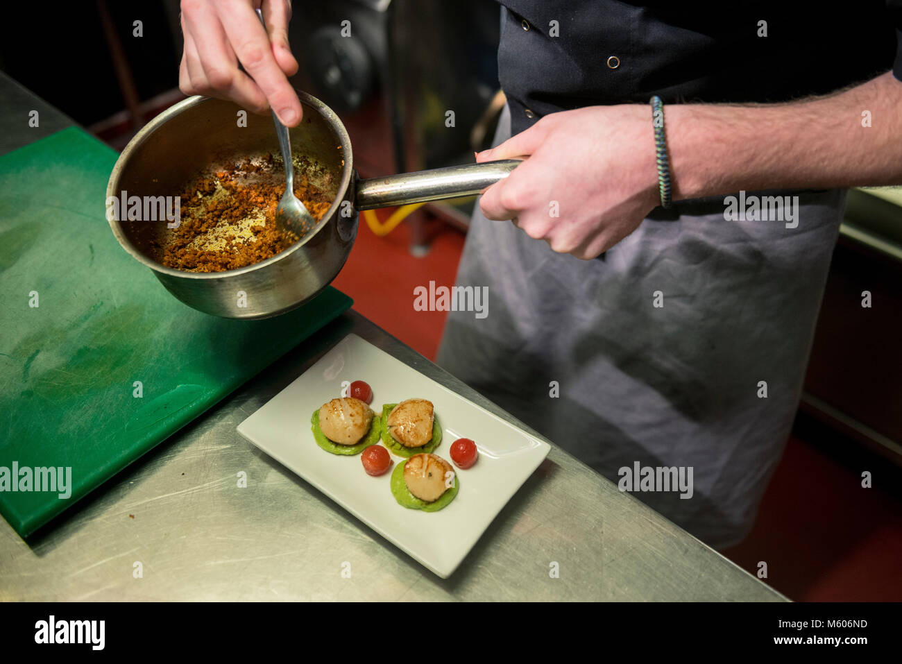 the head chef at a specialist restaurant cooks some amazing food in the ...