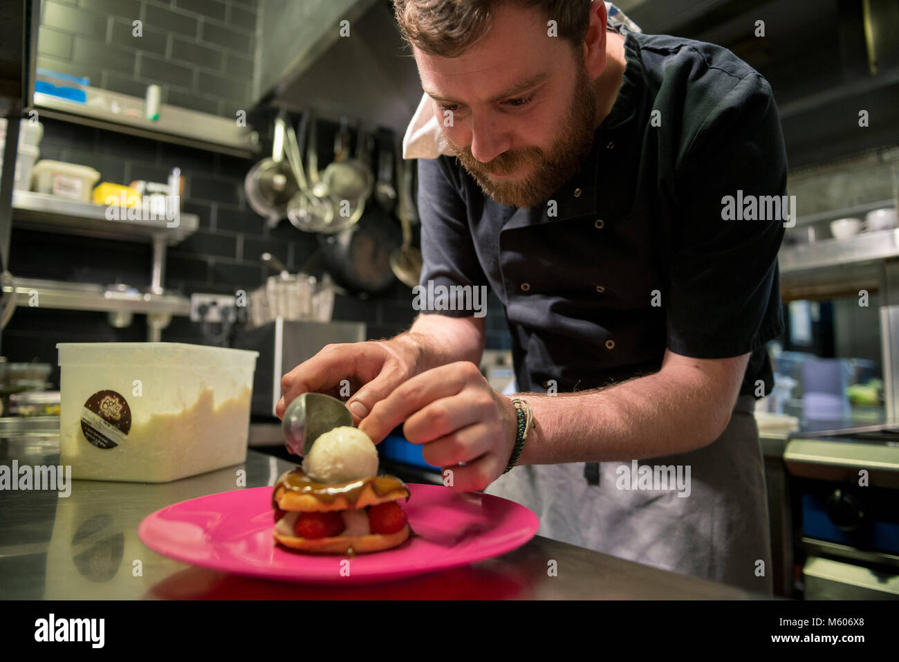 the head chef at a specialist restaurant cooks some amazing food in the ...