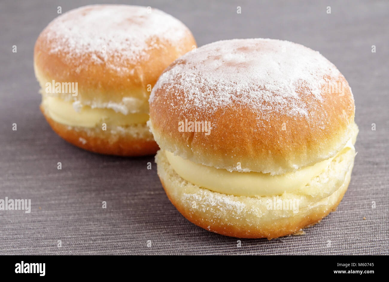 Two cream donuts Stock Photo - Alamy