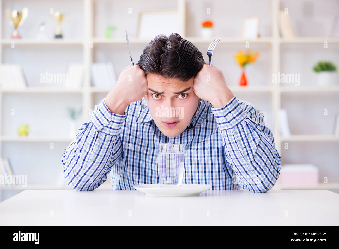 Angry man waiting food in hi-res stock photography and images - Alamy