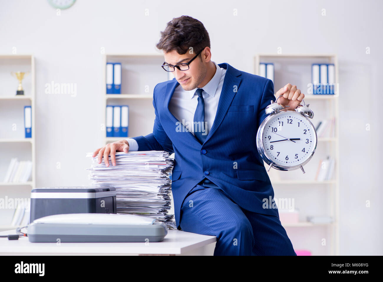 Businessman making copies in copying machine Stock Photo - Alamy