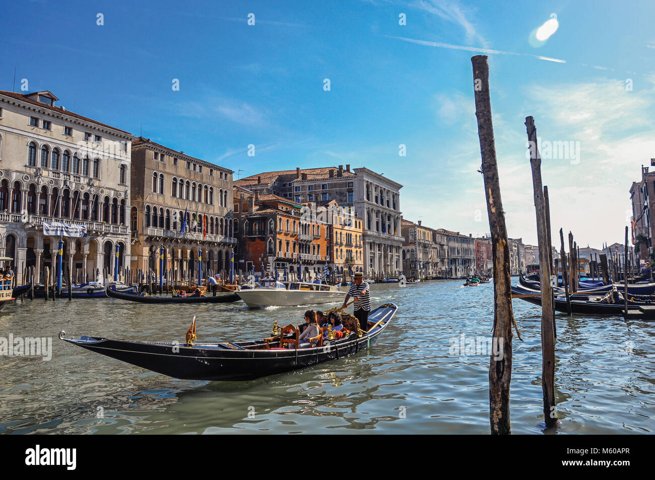 Venice, Italy. View of buildings, piers and gondolas in front of the ...
