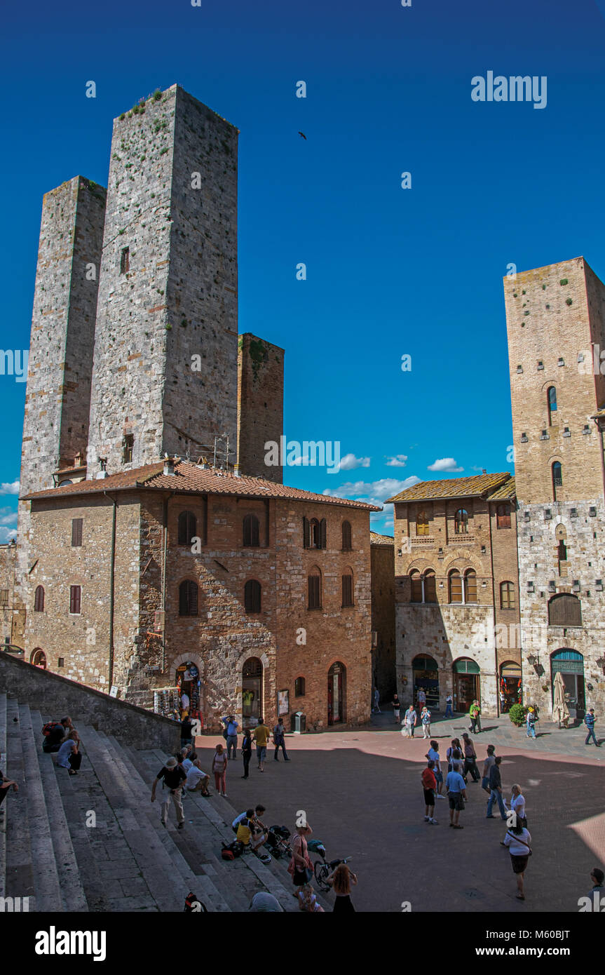 San Gimignano, Italy. View of square with people, old buildings and ...