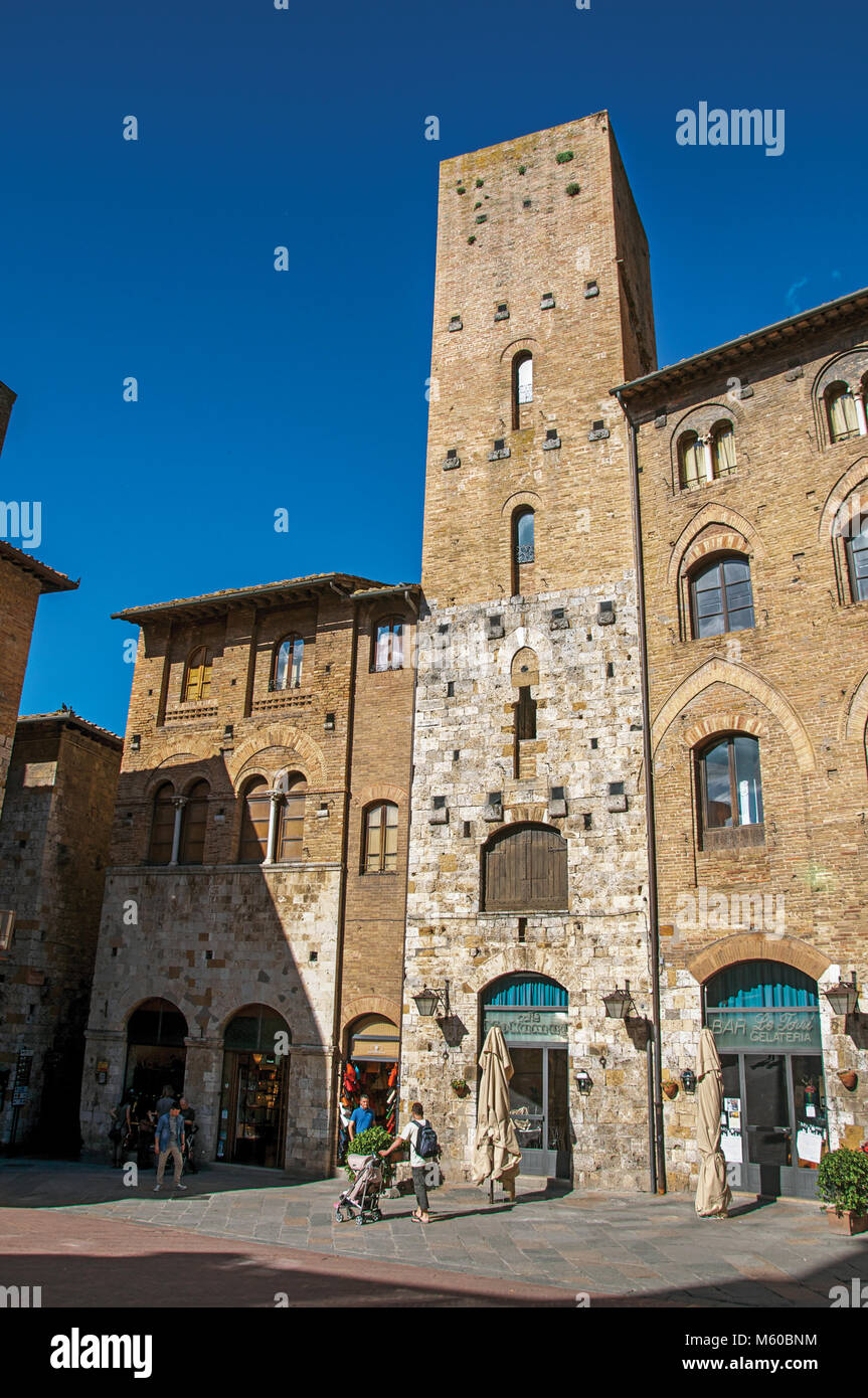 San Gimignano, Italy. View of square with people, old building and ...