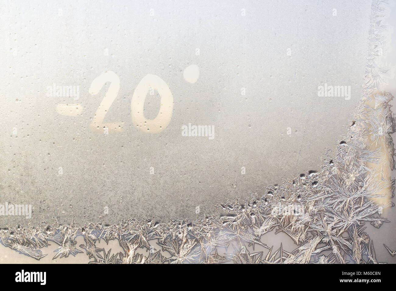 Frost patterns at window glass. Closeup Stock Photo - Alamy