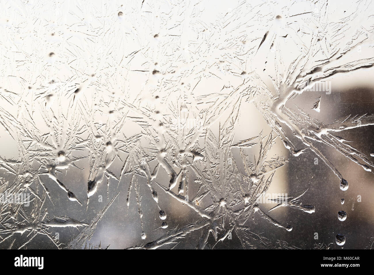 Frost patterns at window glass. Closeup Stock Photo - Alamy