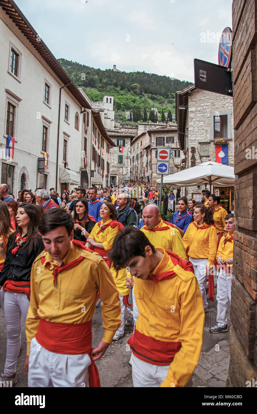 Gubbio, Italy. Colorful crowd participating in the "Feast of Ceri", a ...