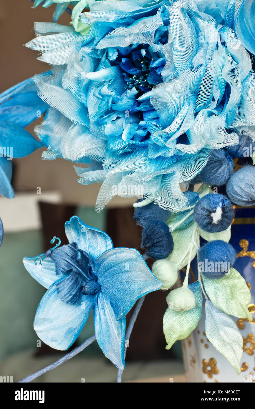 Bouquet with blue large flowers and closed buds. Artificial flowers in ...