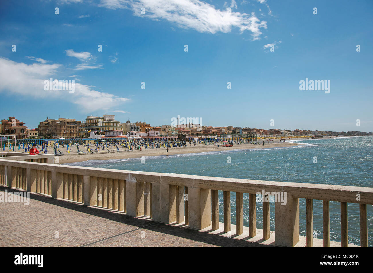 Ostia, Italy. Marble pier, with the beach and the city of Ostia, on a ...