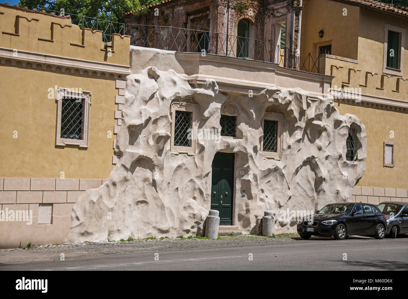 Roma, Italy. Front view of house with creative and unusual street decor ...