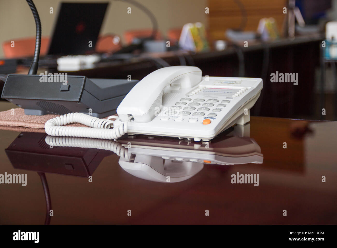 White phone On the brown desk in the conference room, business concept ...