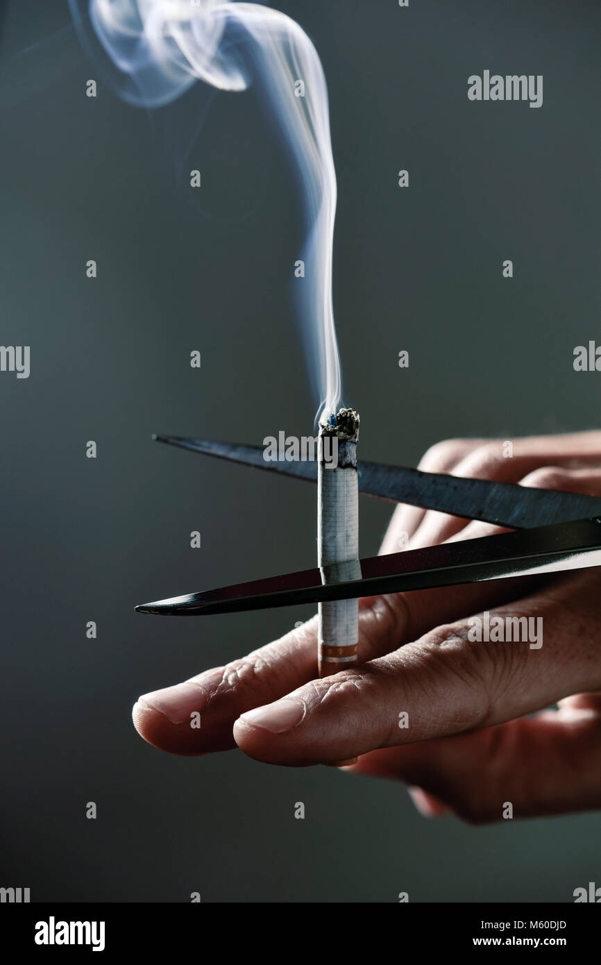 Man scissors cigarette hi-res stock photography and images - Alamy
