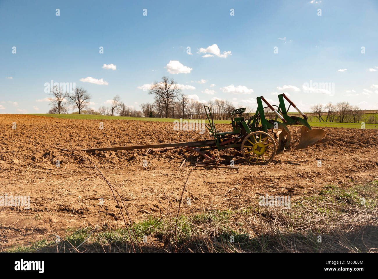 Amish Farm with Old FarmEquipment sitting in the Field on a Autumn Day ...