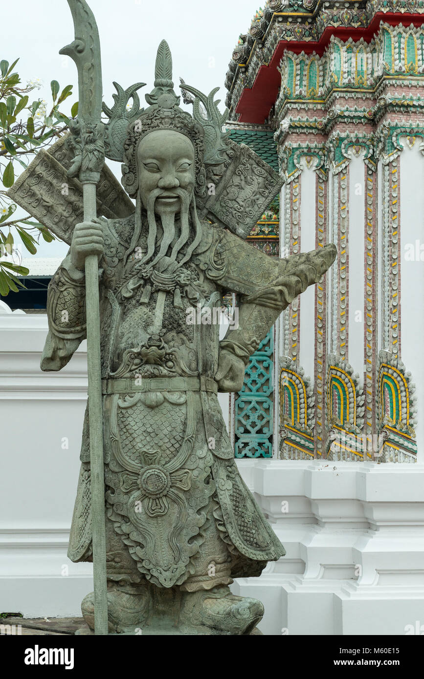 Chinese guardian figure beside a gate in Wat Pho, Phra Nakhon District ...