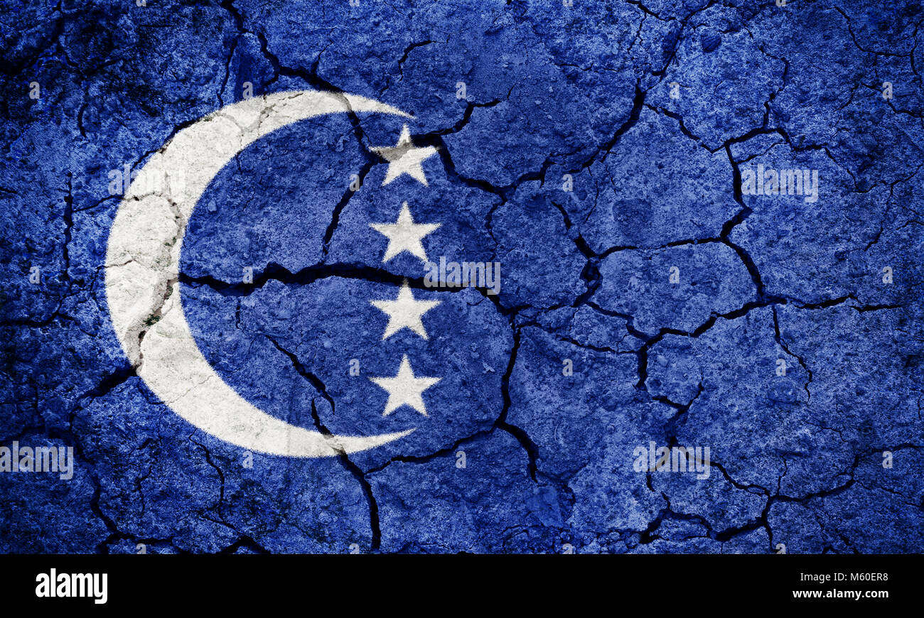 Autonomous Island of Grande Comore flag on dry earth ground texture ...