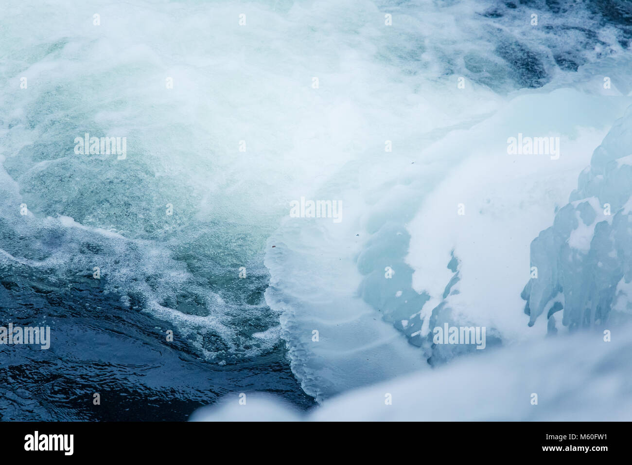 Beautiful frozen waterfall in central Norway. Winter landscape with a ...