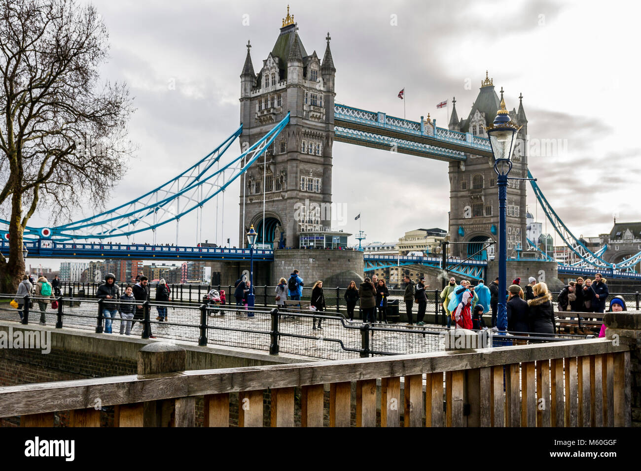 Tourists, people near a Side profile of London Tower Bridge on a cloudy ...