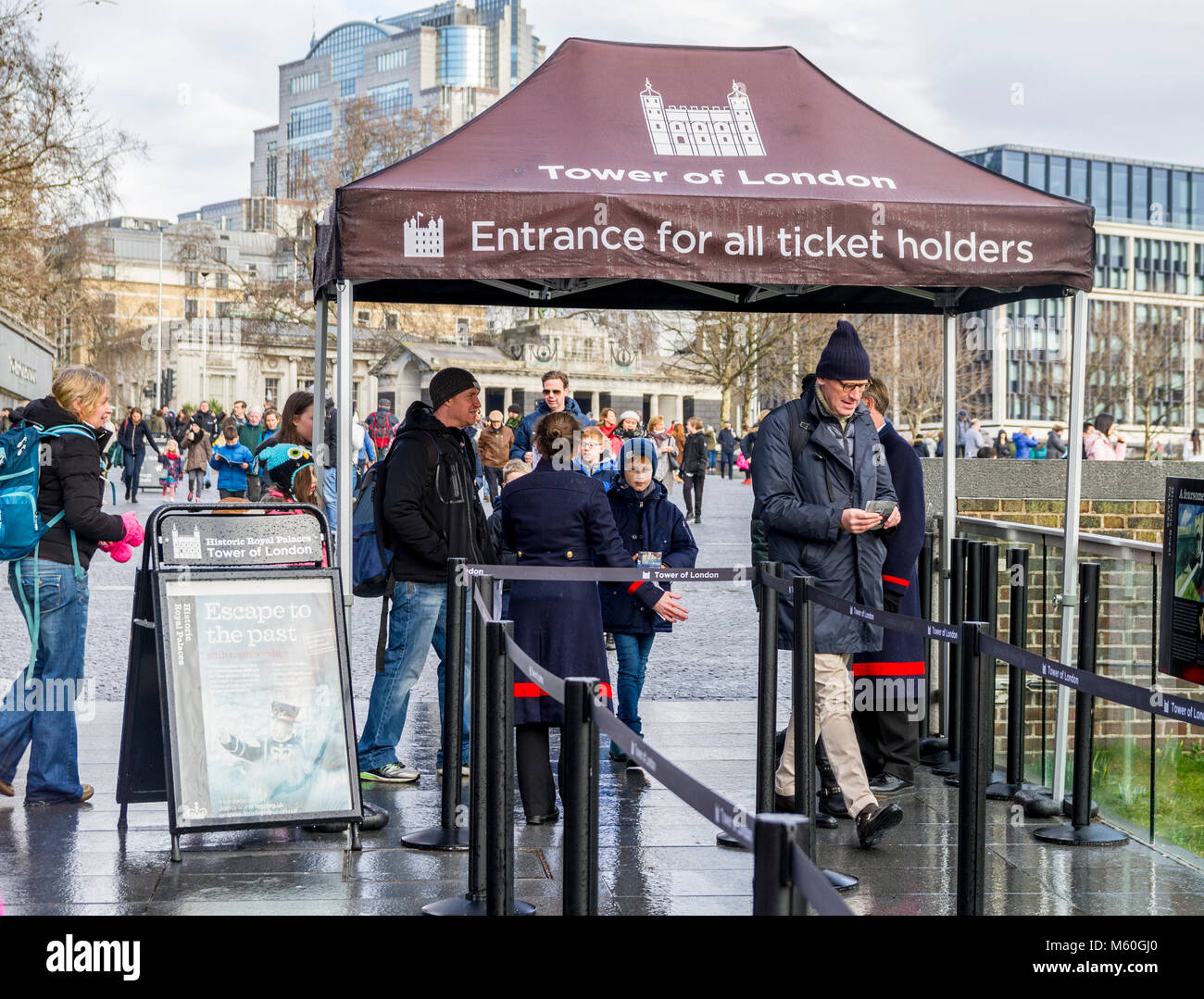 Tourists buying tickets, visiting the Tower of London, top London sight ...