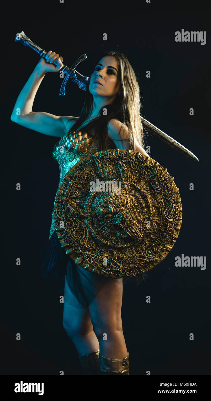 valkyrie warrior, woman with golden armor iron coat and big warrior ...