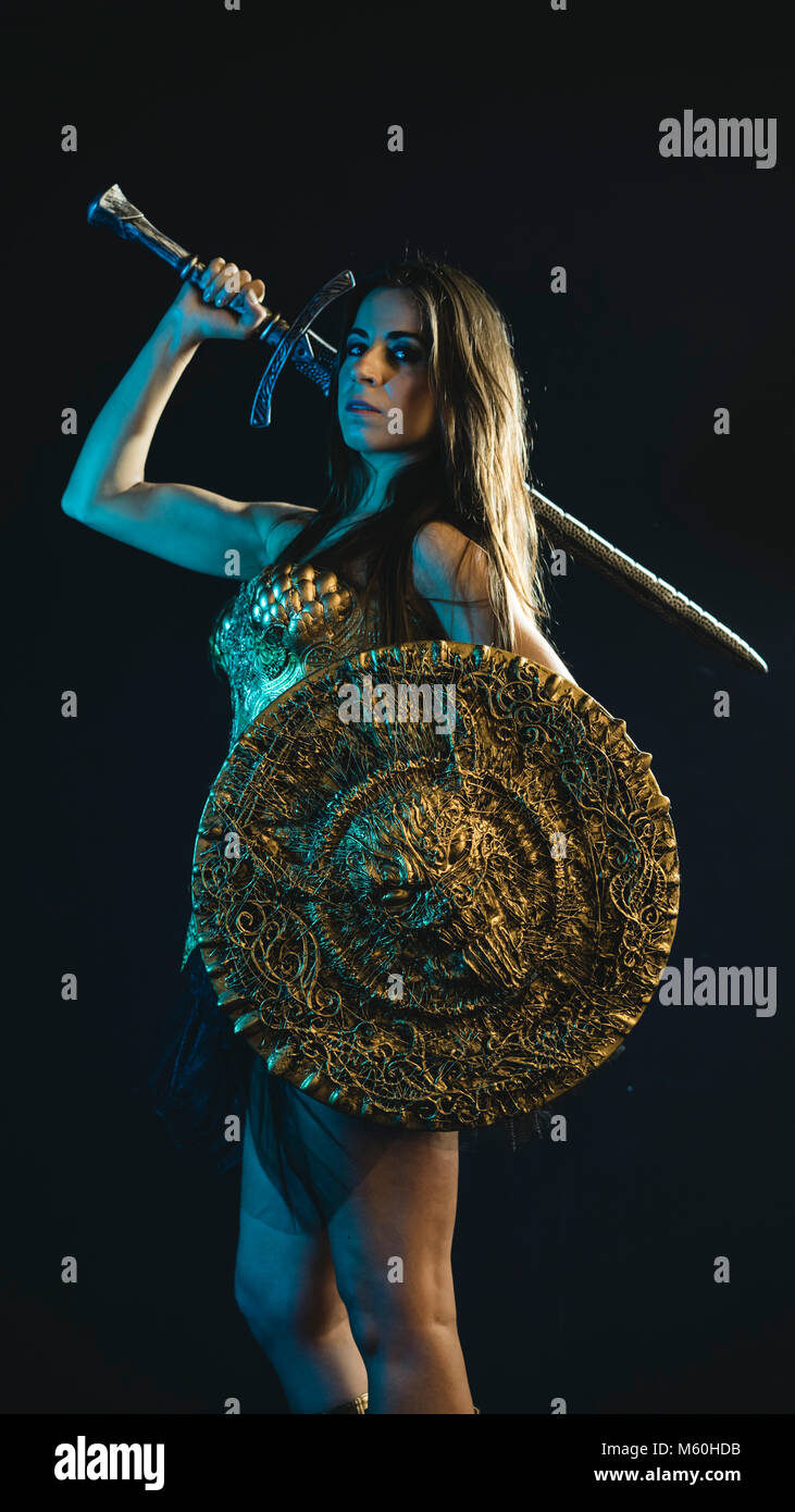 valkyrie warrior, woman with golden armor iron coat and big warrior ...