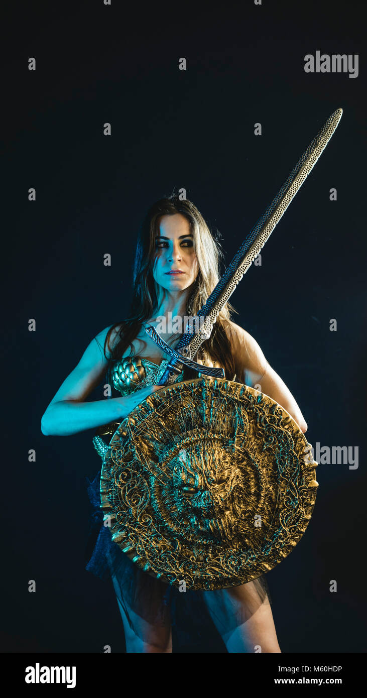 valkyrie warrior, woman with golden armor iron coat and big warrior ...