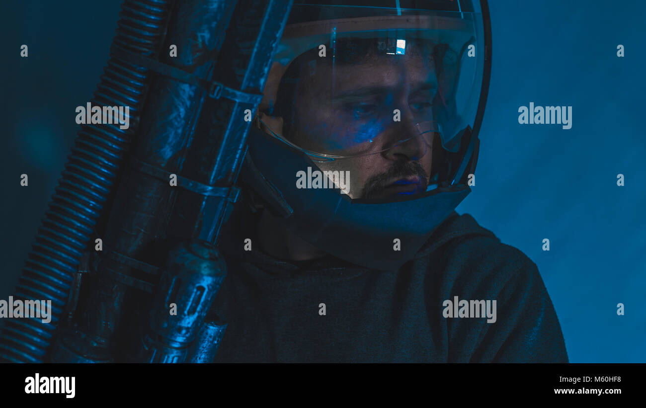 Galaxy space man with led lights helmet, space suit and gun in the ...