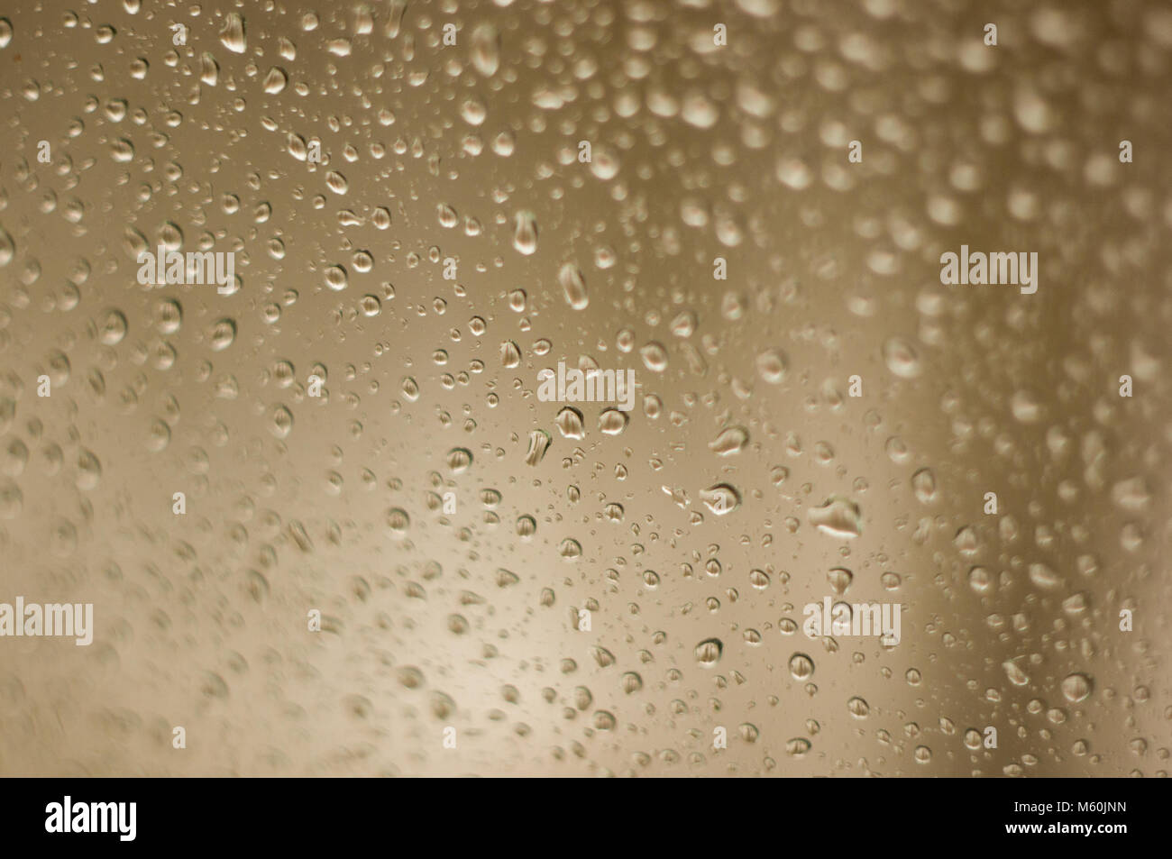 raindrops on the window glass, toned, close up Stock Photo - Alamy