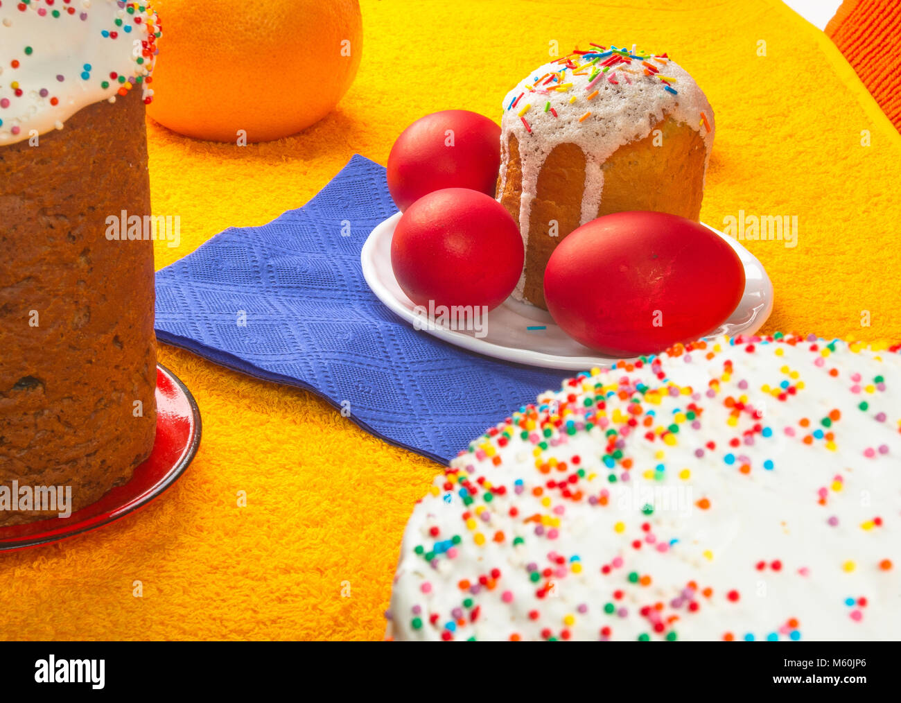 Kulichi, traditional Russian Easter cake with icing and dyed eggs Stock ...