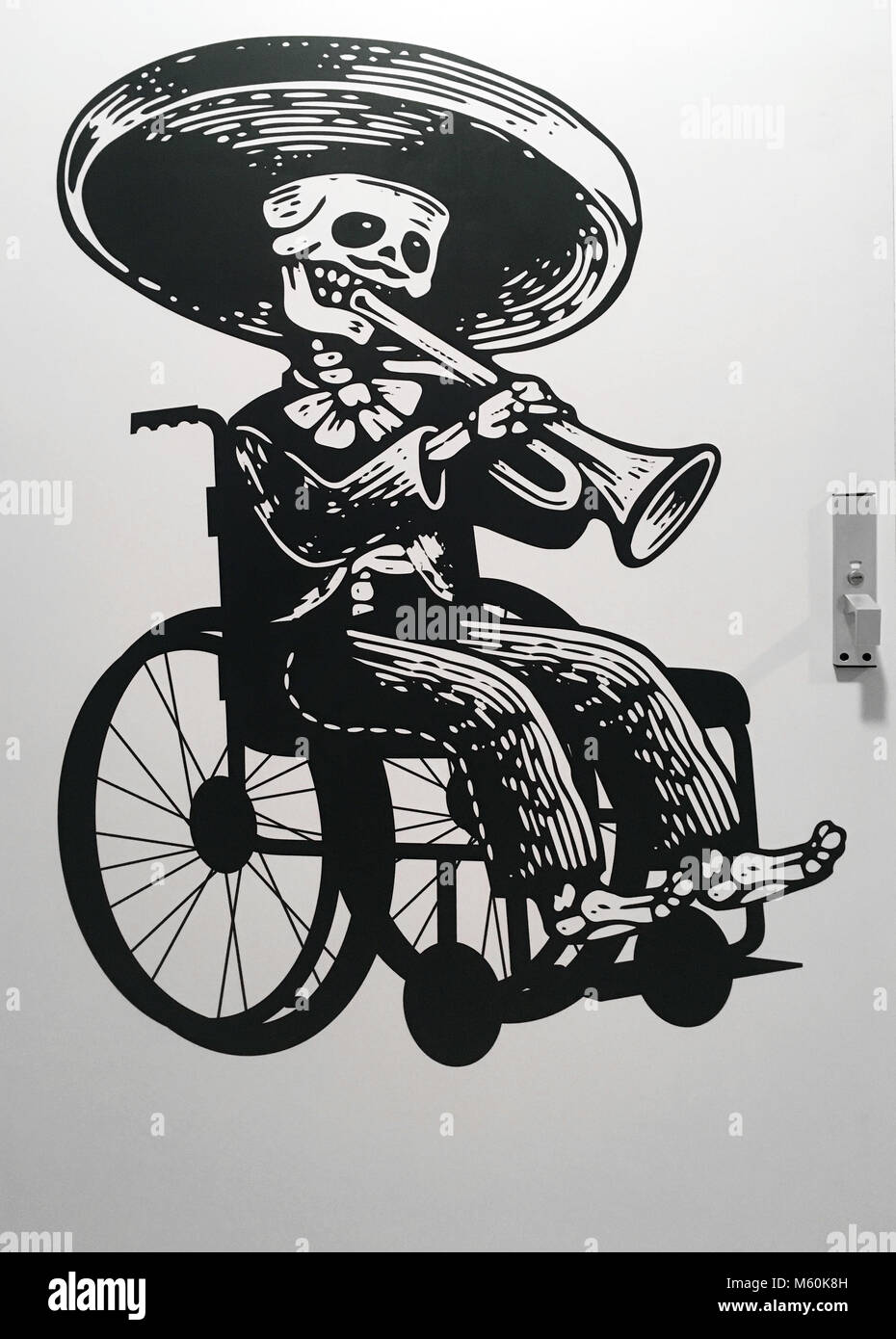 Day of the dead trumpeter sign for a disabled toilet in a Mexican ...