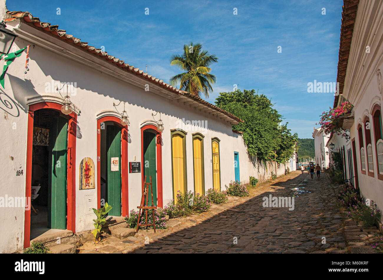 Paraty, Brazil. Cobblestone street with houses under blue sunny sky in ...