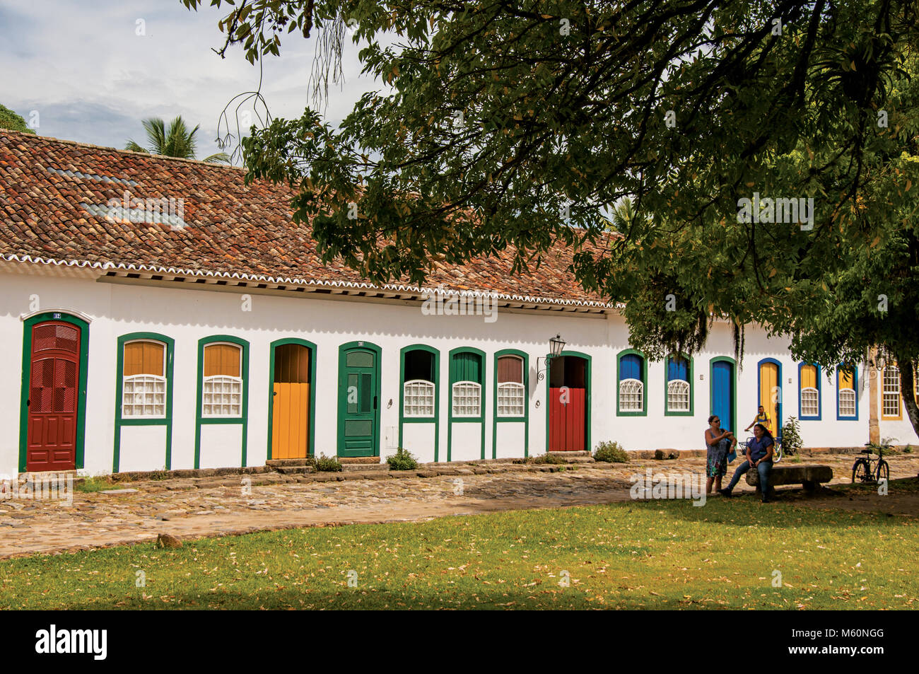 Paraty, Brazil. Cobblestone street with old houses and big tree in ...