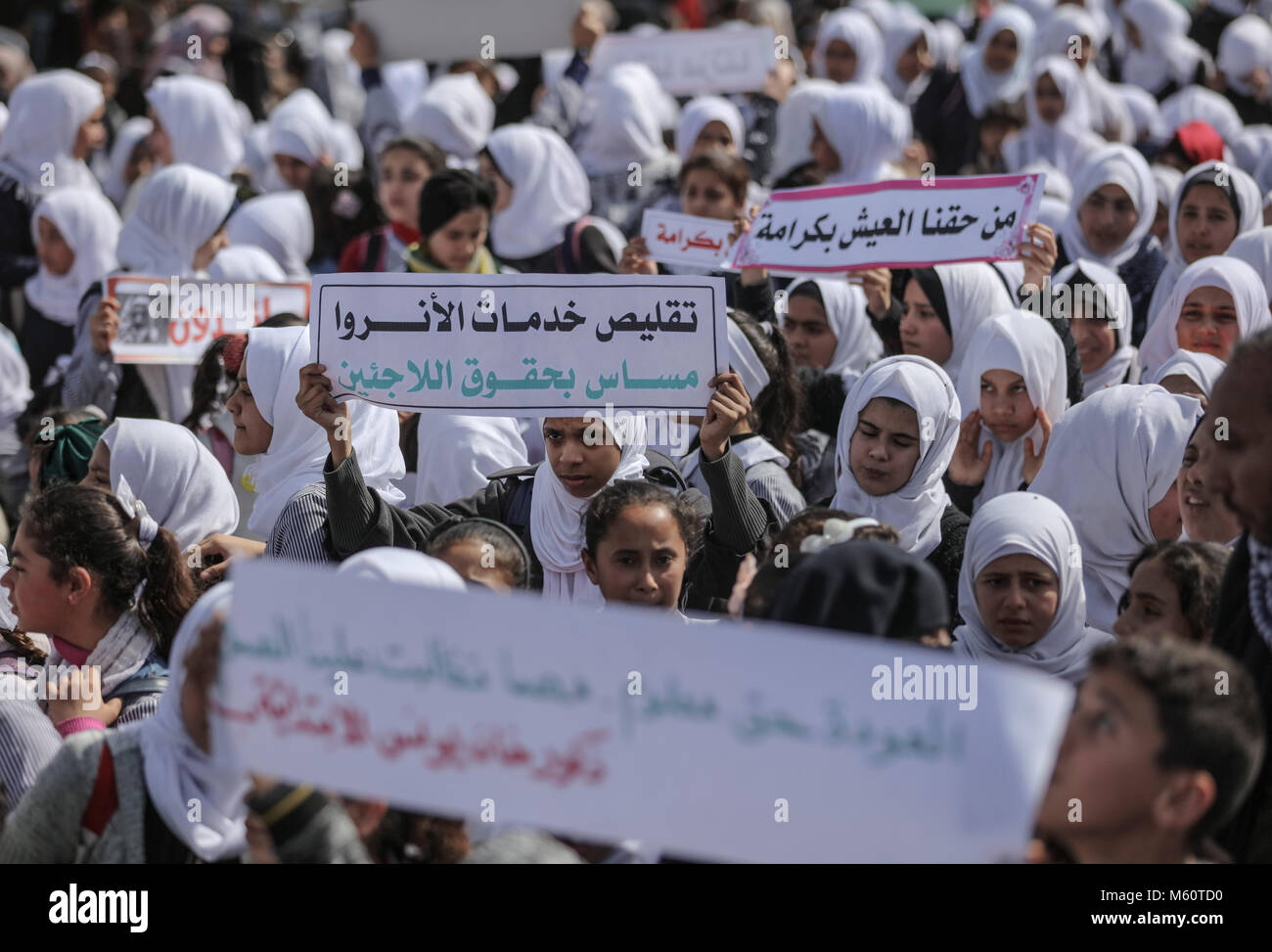 Palestinian students of United Nations-run schools take part in a ...