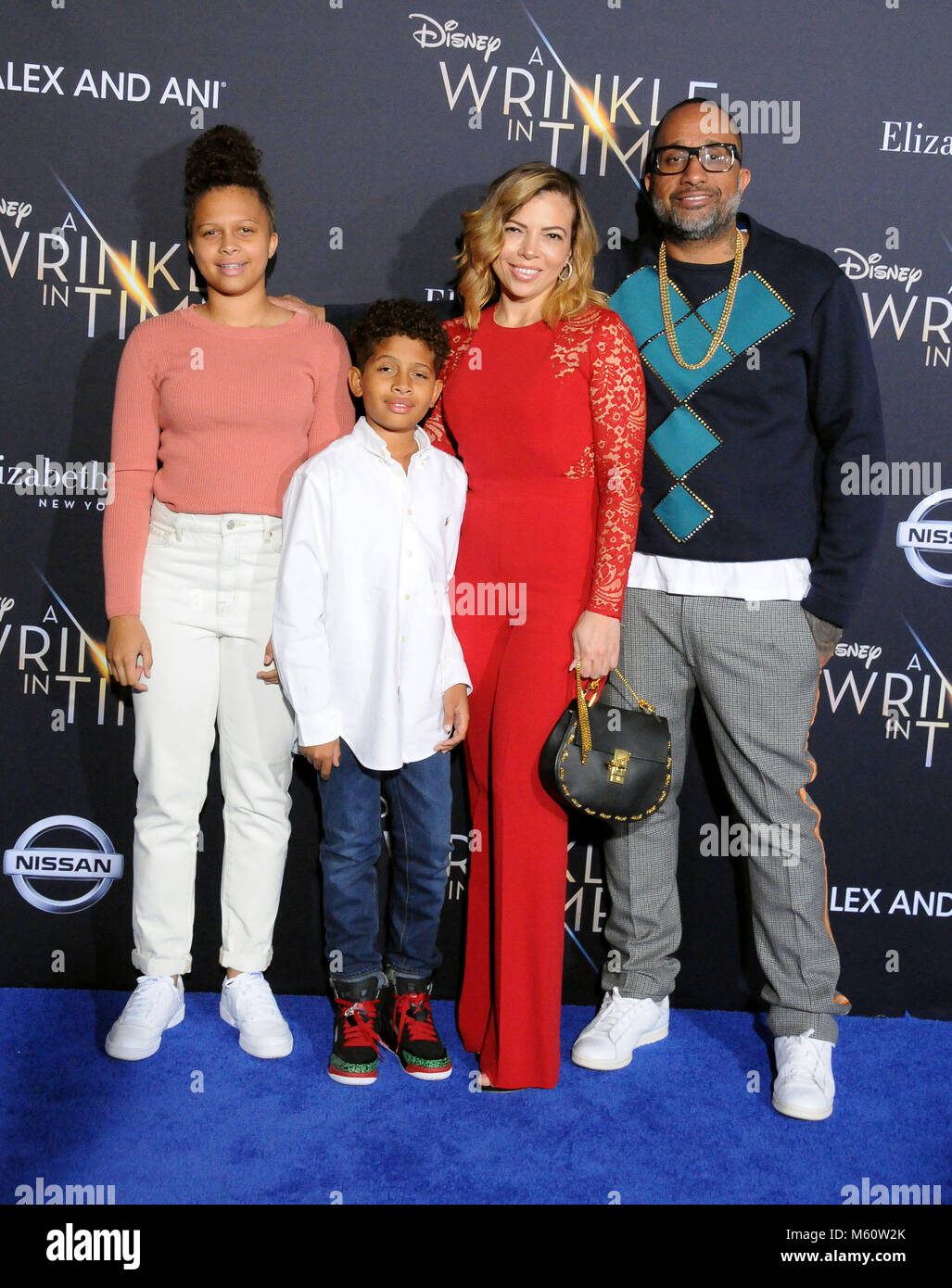 Los Angeles, USA. 26th Feb, 2018. Writer Kenya Barris (R) and family ...