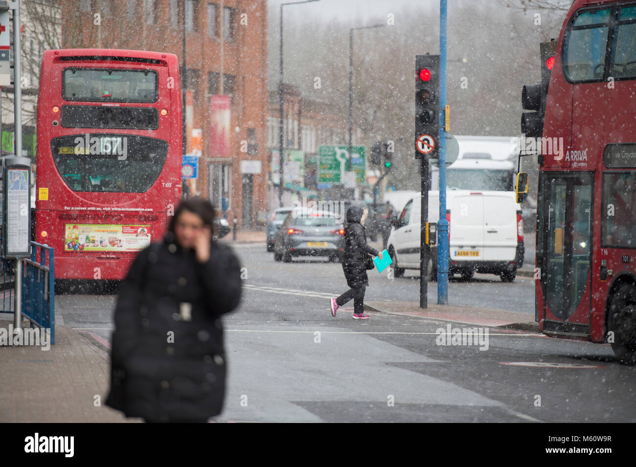 Morden, Surrey, UK. 27 February 2018. Heavier snow flurries falling at ...