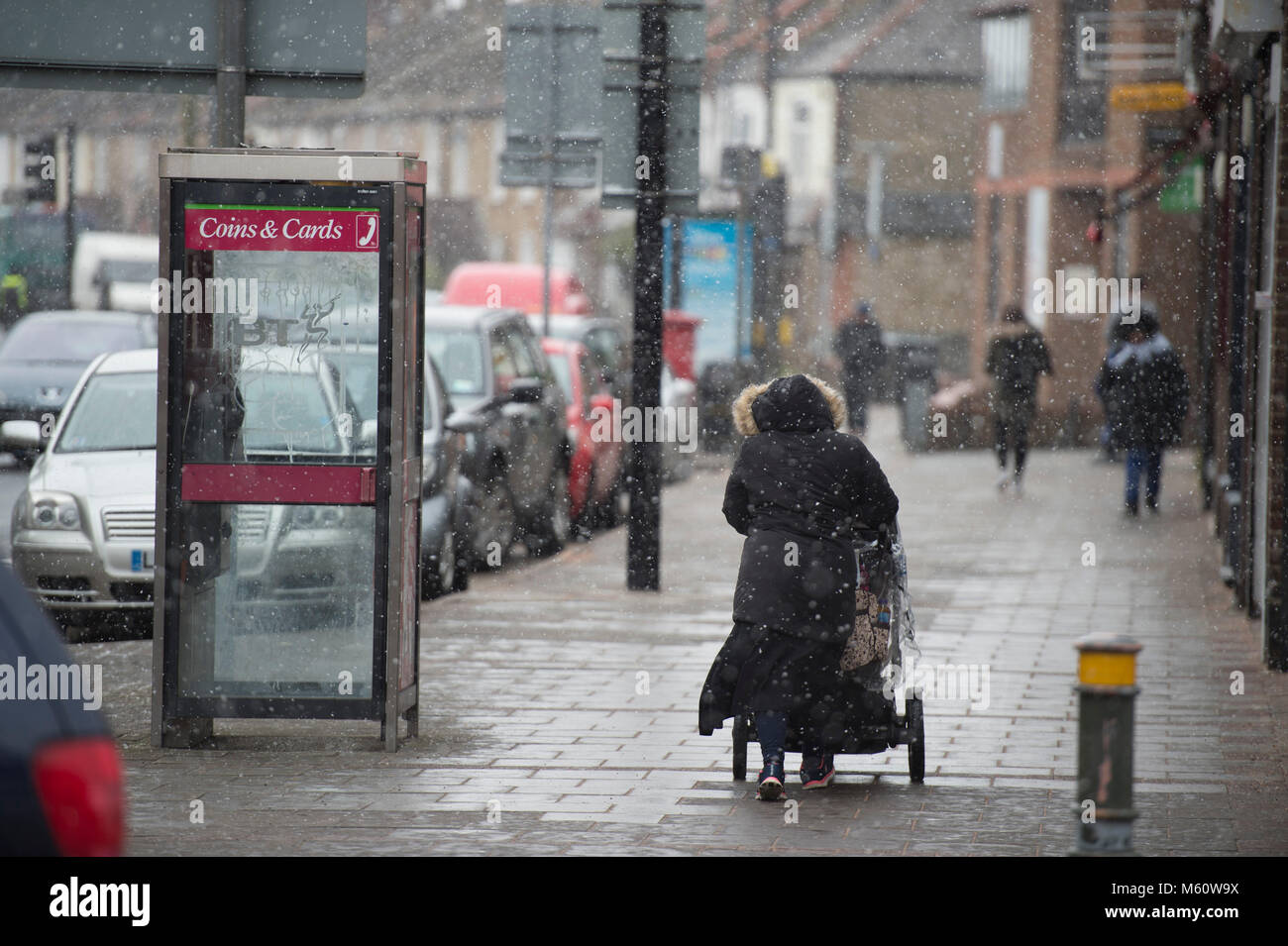 Morden, Surrey, UK. 27 February 2018. Heavier snow flurries falling at ...