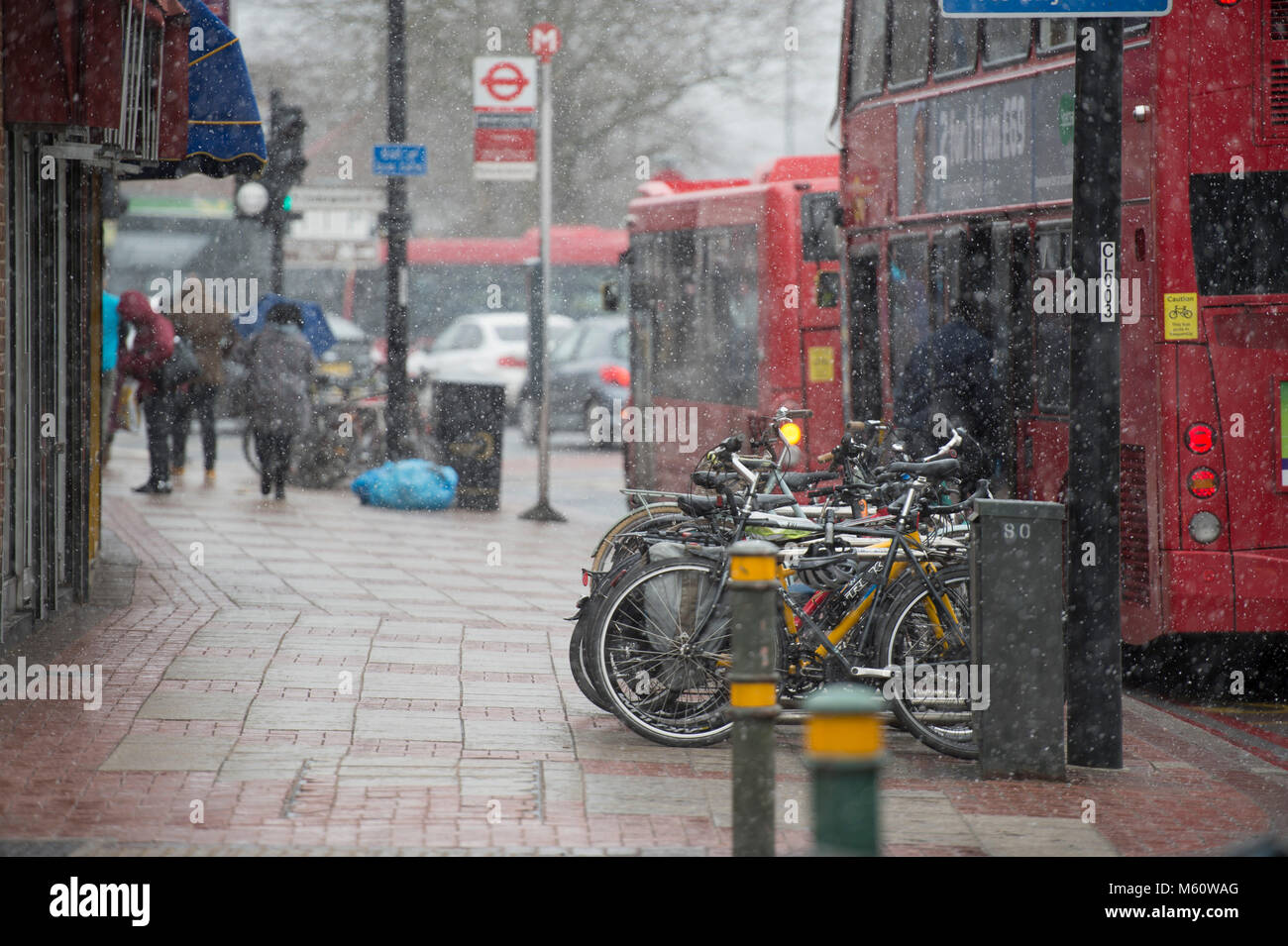 Morden, Surrey, UK. 27 February 2018. Heavier snow flurries falling at ...