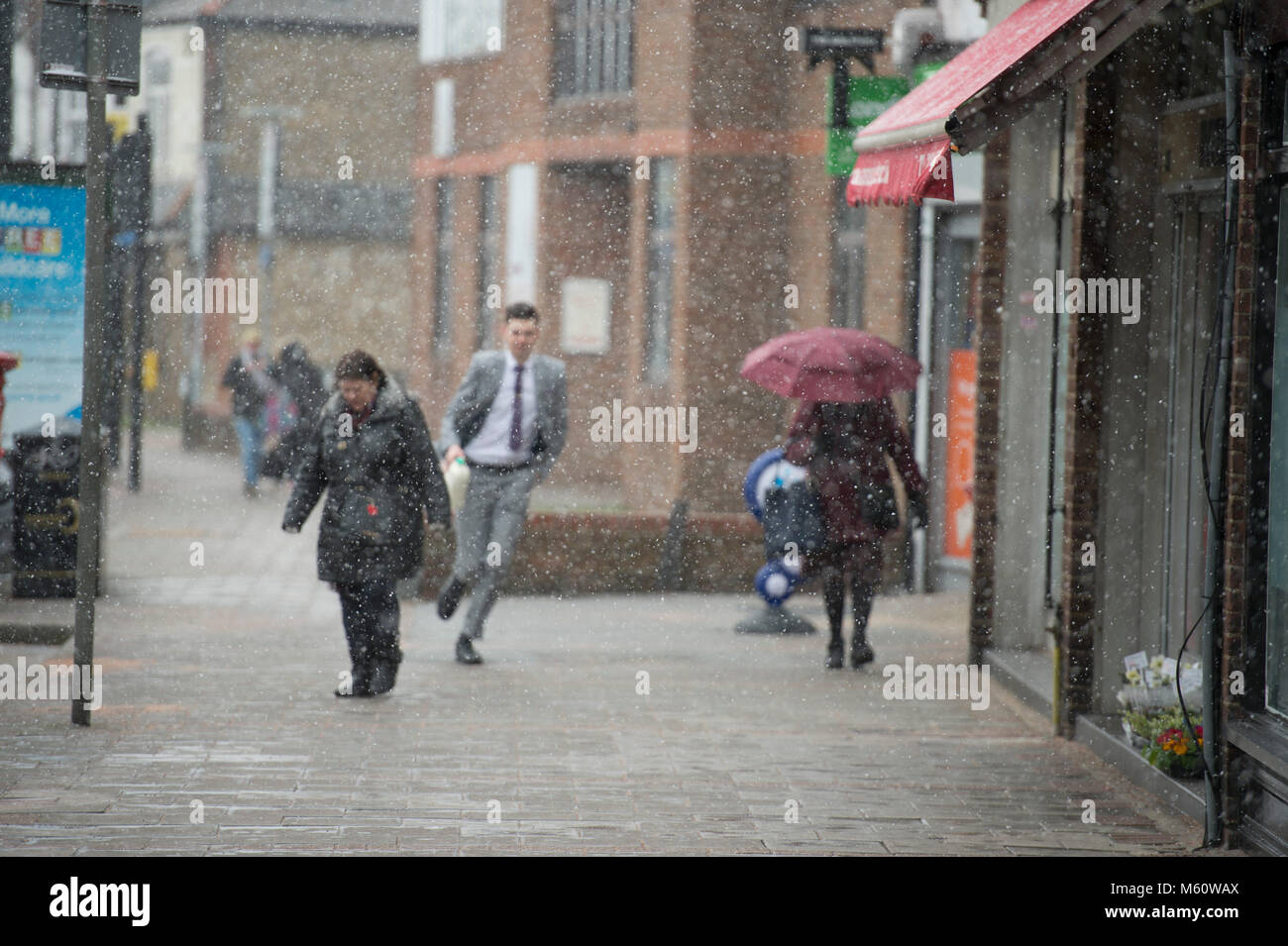 Morden, Surrey, UK. 27 February 2018. Heavier snow flurries falling at ...