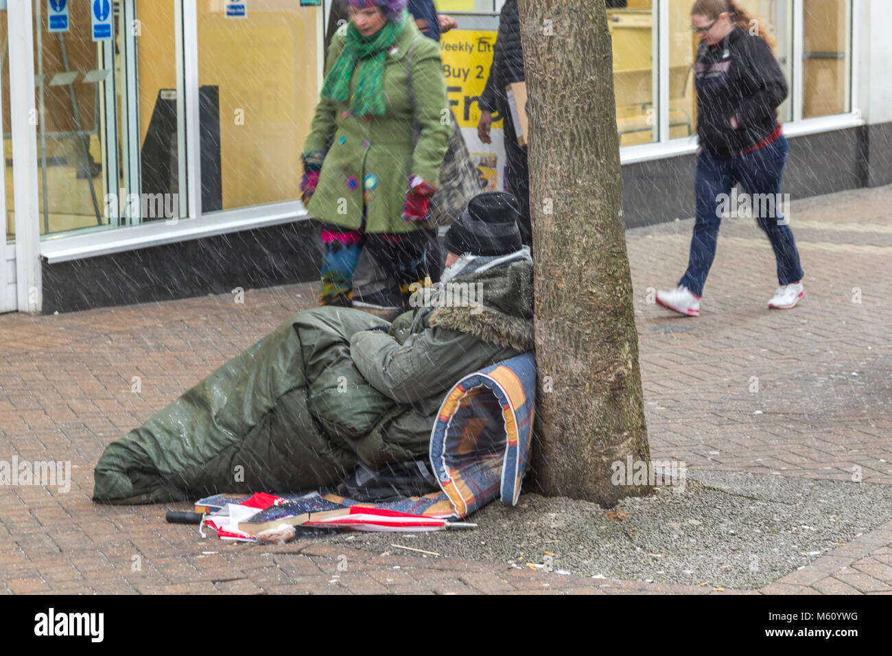 Homeless wrapped in sleeping bag hi-res stock photography and images ...
