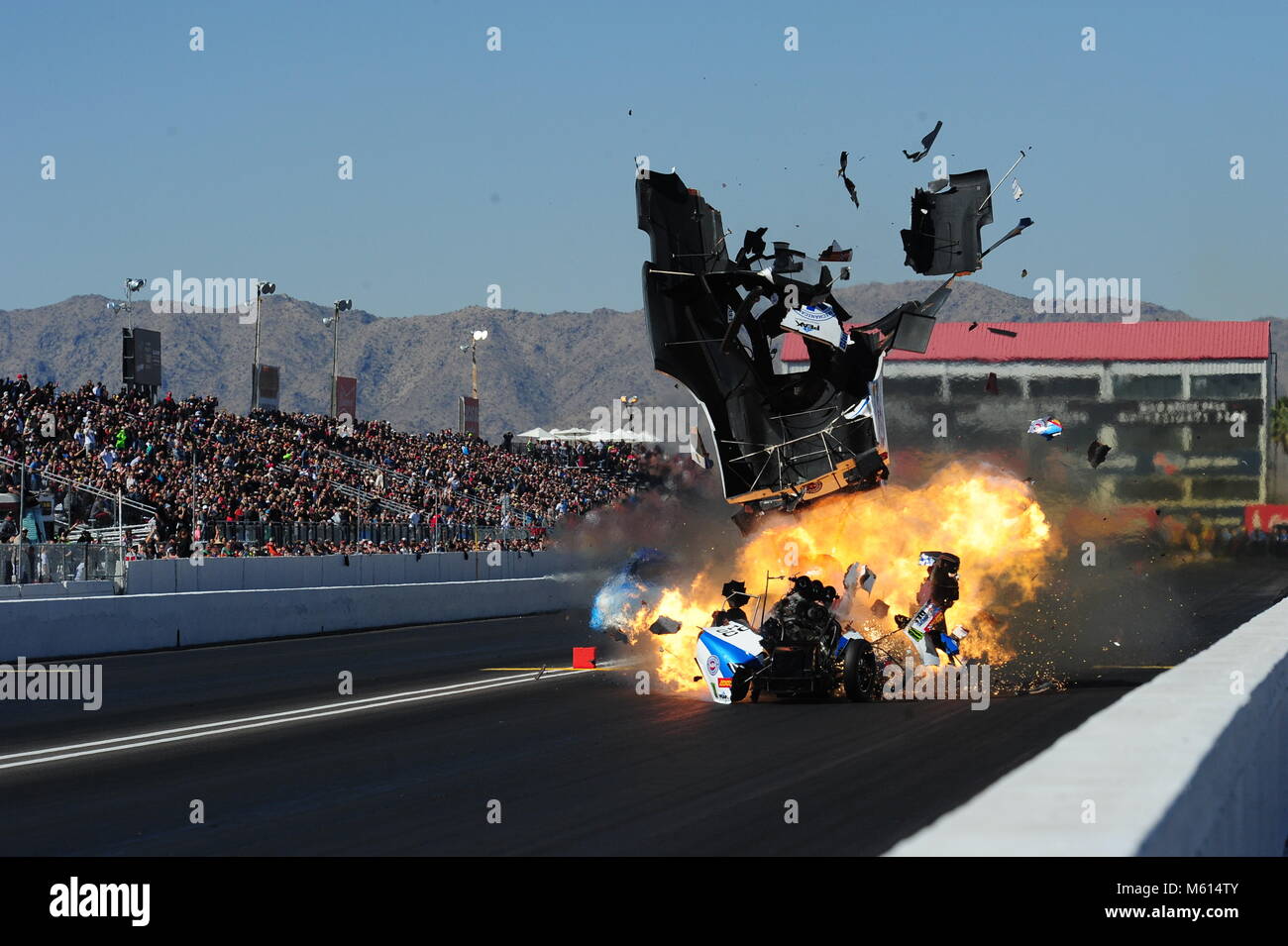 Chandler, AZ, USA. 25th Feb, 2018. Funny Car driver John Force explodes ...