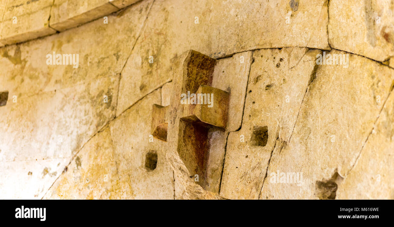 stone cross on arch of ancient wall Stock Photo - Alamy