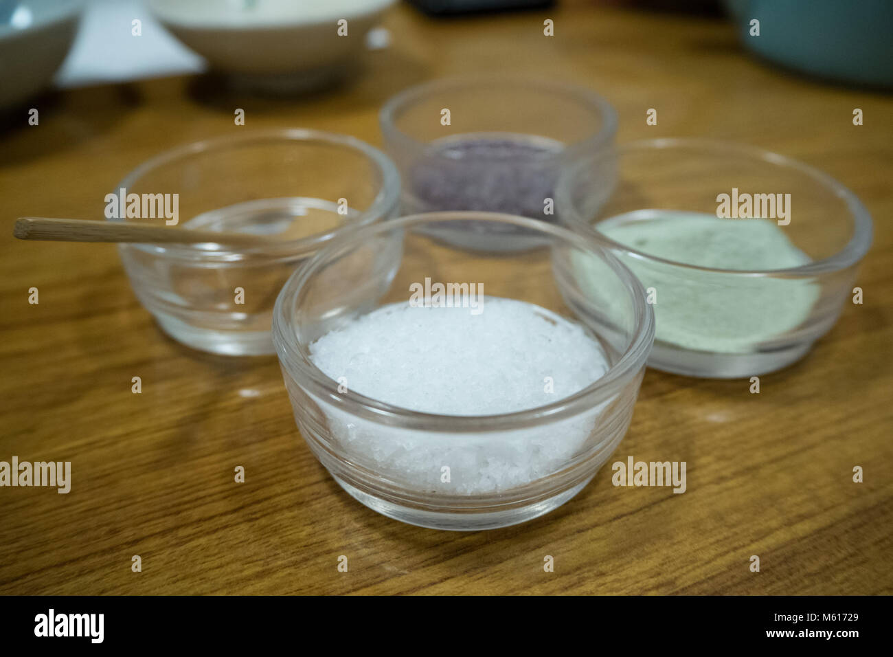 Condiments in a Japanese restaurant which include salt, pepper, vinegar ...