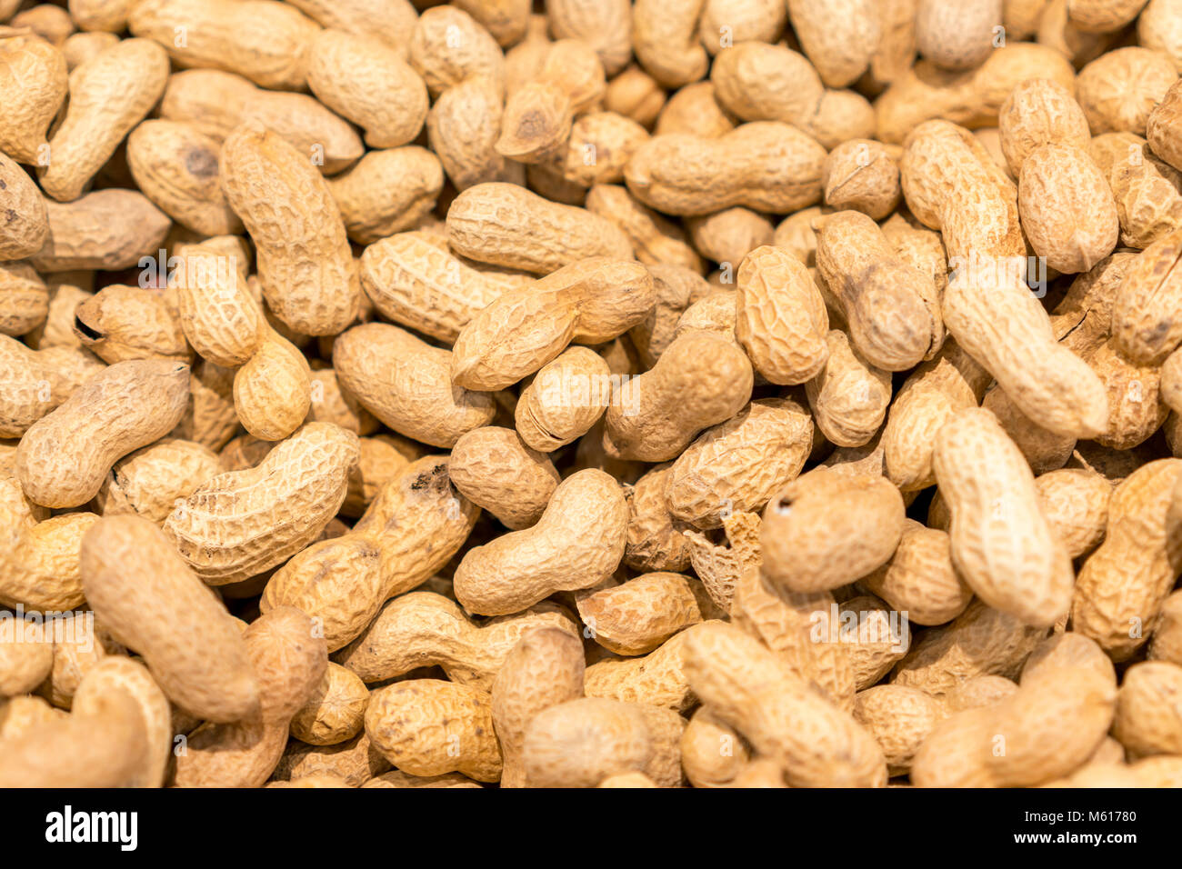 Many peanuts in shells, one upon the other. background Stock Photo - Alamy