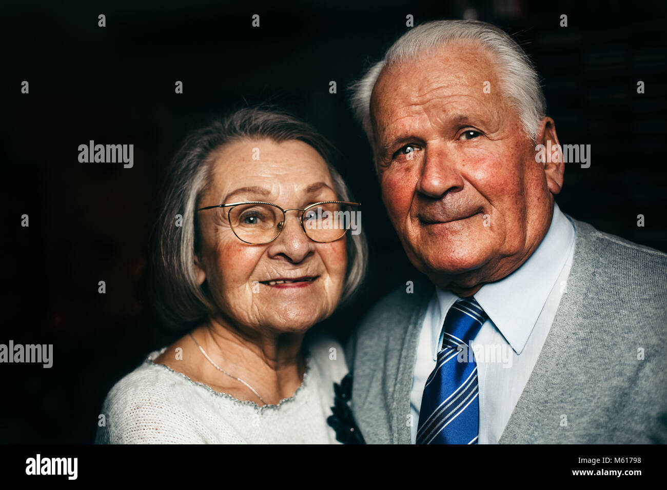 senior couple smiling at the camera Stock Photo - Alamy