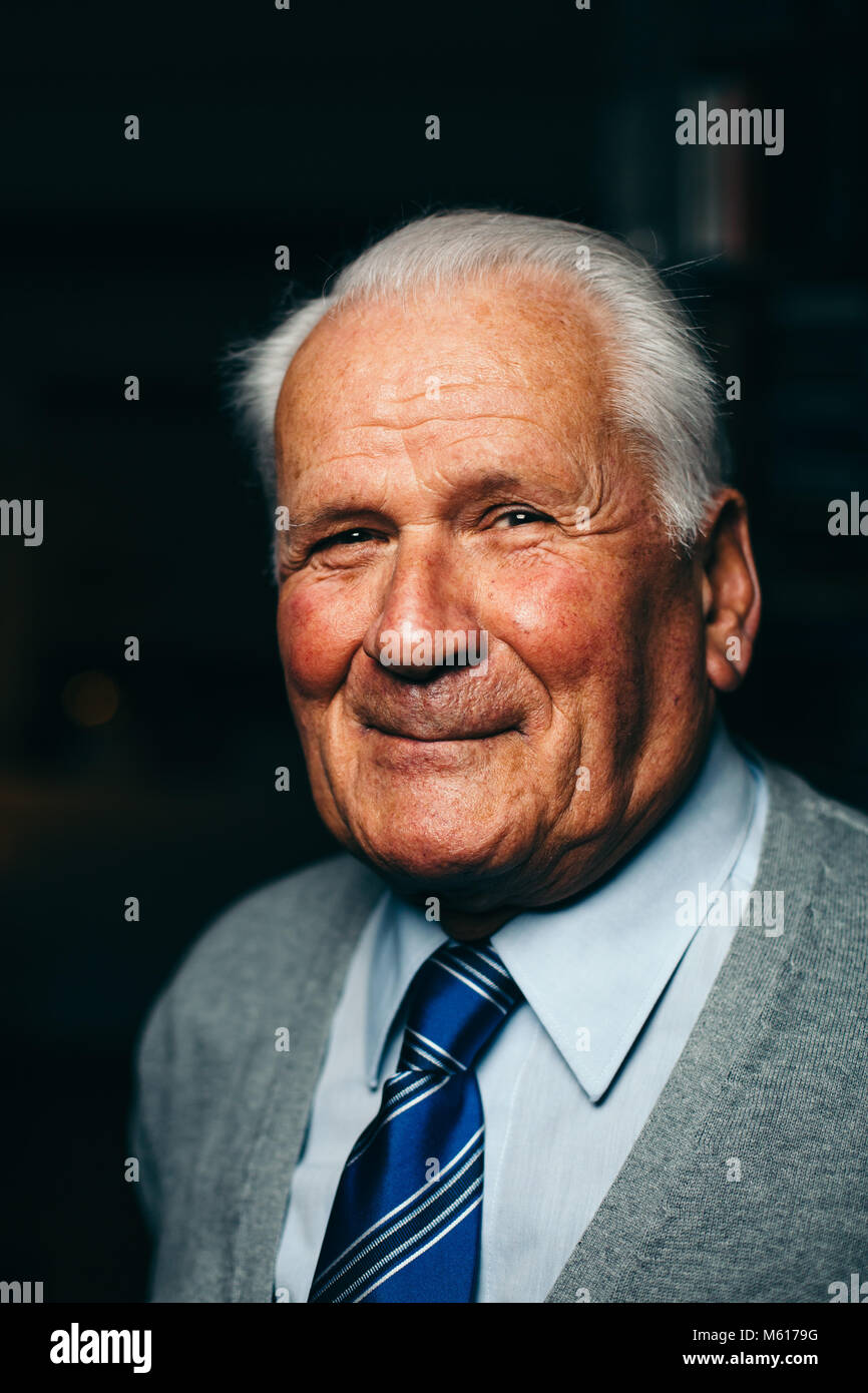 happy senior man smiling at camera Stock Photo - Alamy