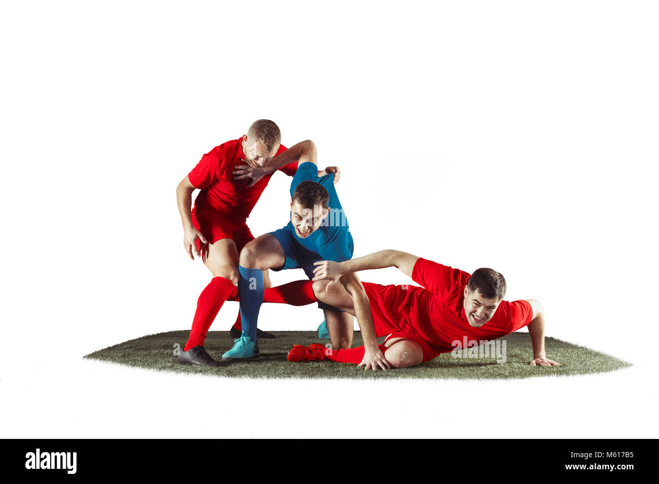 Football players tackling for the ball over white background Stock ...