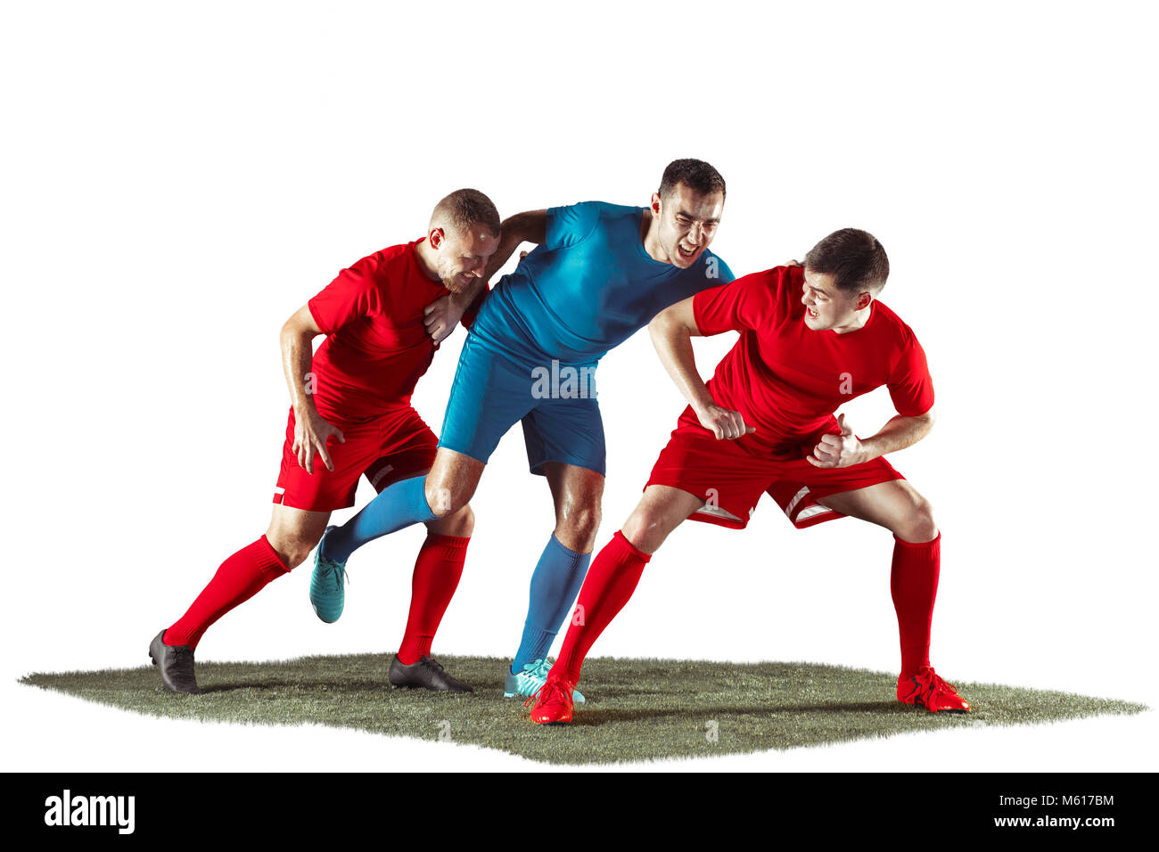 Football players tackling for the ball over white background Stock ...